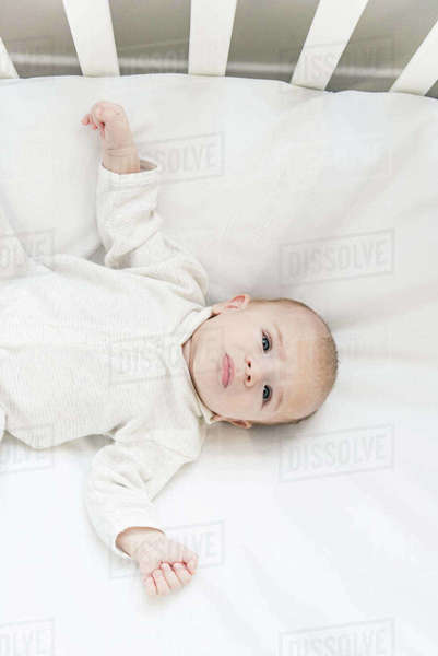 Overhead view of adorable baby in crib - Royalty-free Stock Photo ...