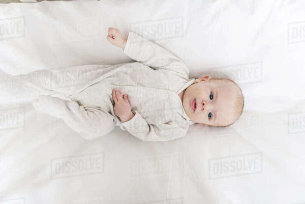 Overhead view of cute little baby in crib - Royalty-free Stock Photo ...