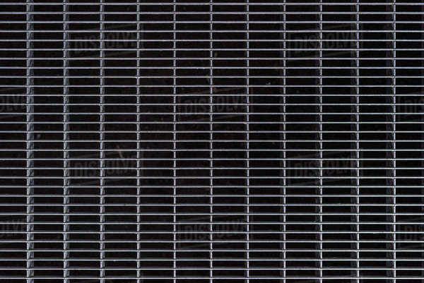 Full frame image of grey metal cage background - Stock Photo - Dissolve