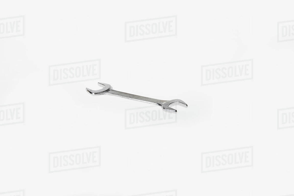 Silver colored wrench tool isolated on white - Stock Photo - Dissolve