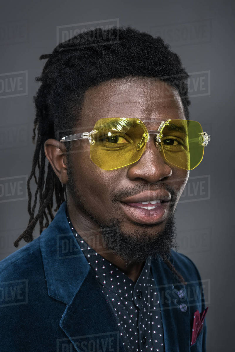 Portrait Of Handsome African American Man In Yellow Sunglasses Isolated