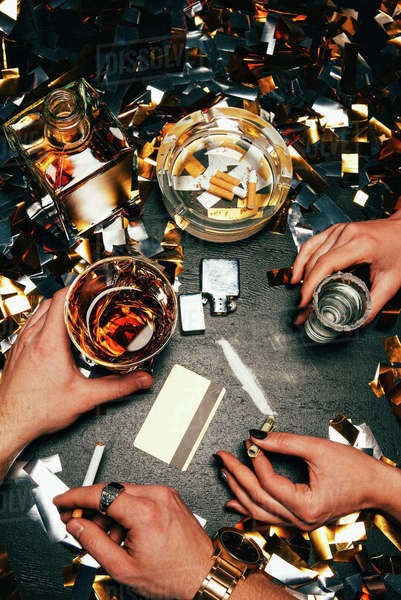 Cropped image of couple celebrating with cocaine, alcohol and ...