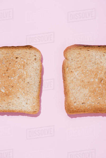 Top view of roasted toasts on pink surface - Royalty-free Stock Photo ...