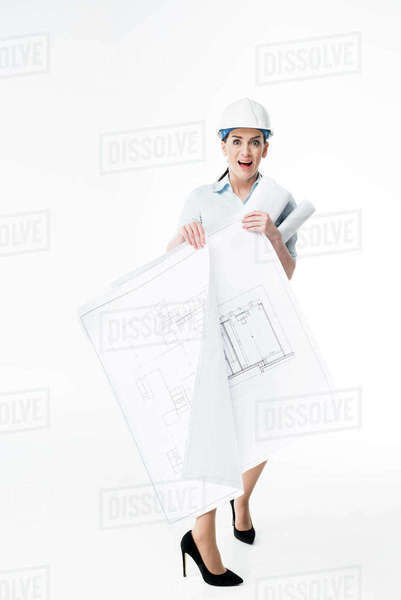 Confused female architect in hard hat holding blueprints isolated on ...