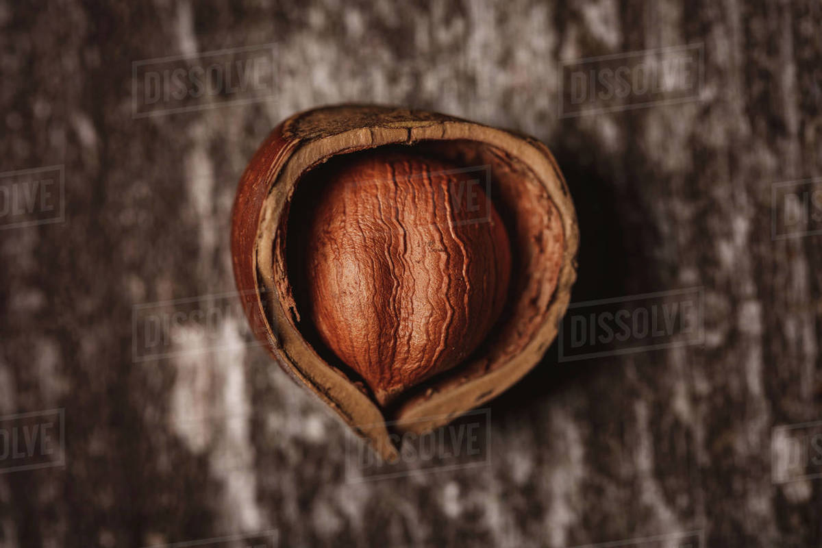top view of hazelnut in husk on wooden surface - Royalty-free Stock ...