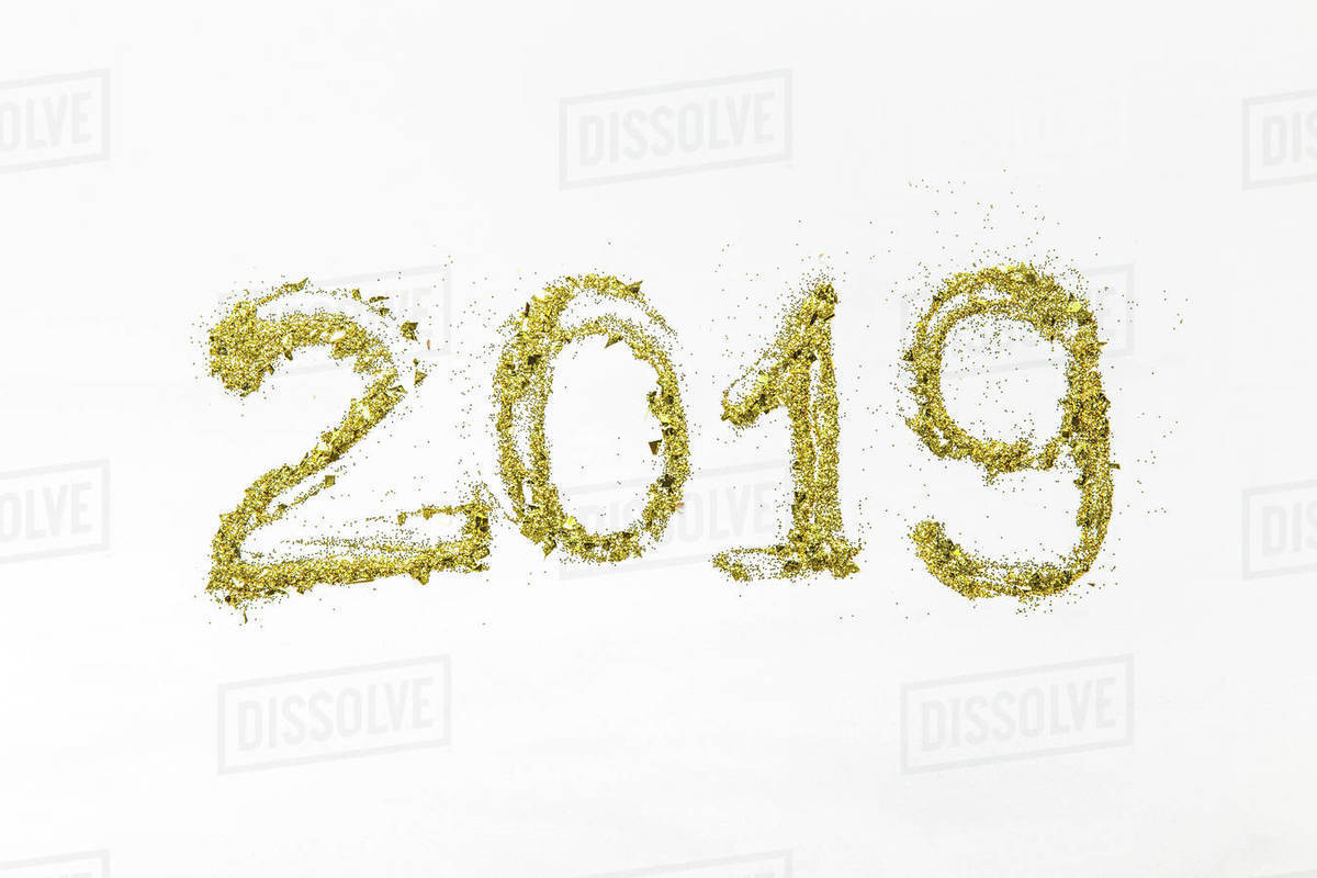 Golden glittering 2019 numbers on white background - Stock Photo - Dissolve