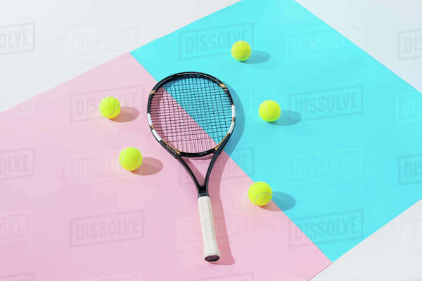 Tennis racket and yellow balls on blue and pink papers - Royalty-free ...