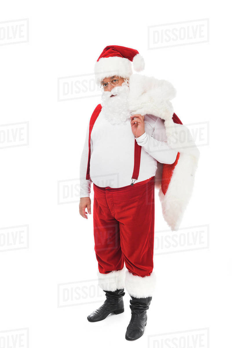 full length view of santa claus in suspenders standing isolated on ...