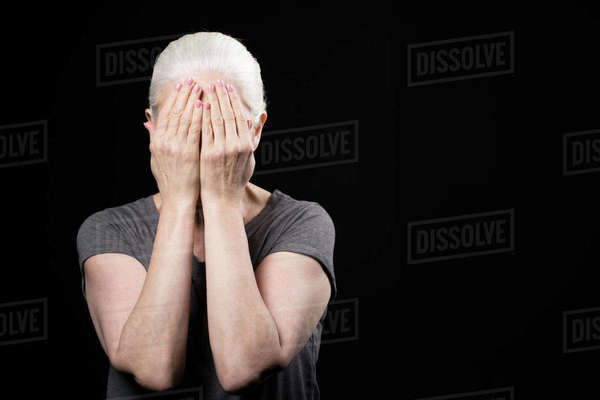 Portrait of scared grey hair woman isolated on black - Royalty-free ...
