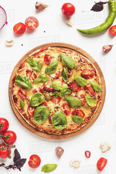 Top view of delicious italian pizza on wooden board and various ...