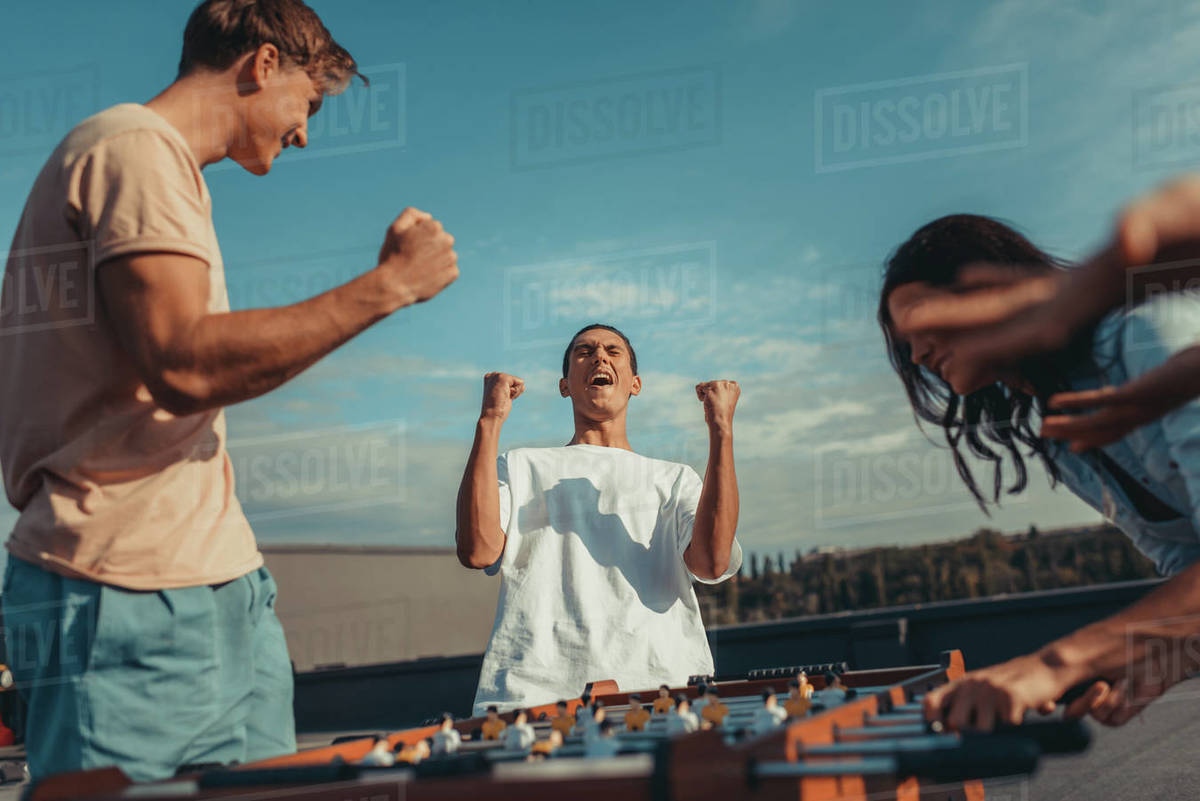Happy young men wins in kicker on roof - Royalty-free Stock Photo ...