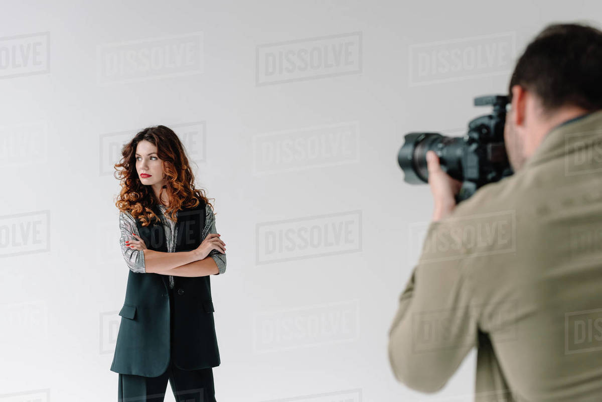 professional photographer and attractive model on fashion shoot in ...