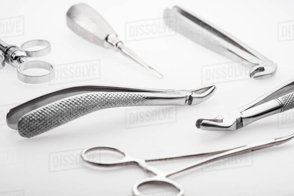 Close-up view of set of dental instruments isolated on white - Royalty ...