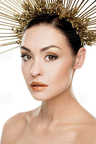 Portrait of gorgeous woman in golden headpiece and stylish makeup ...
