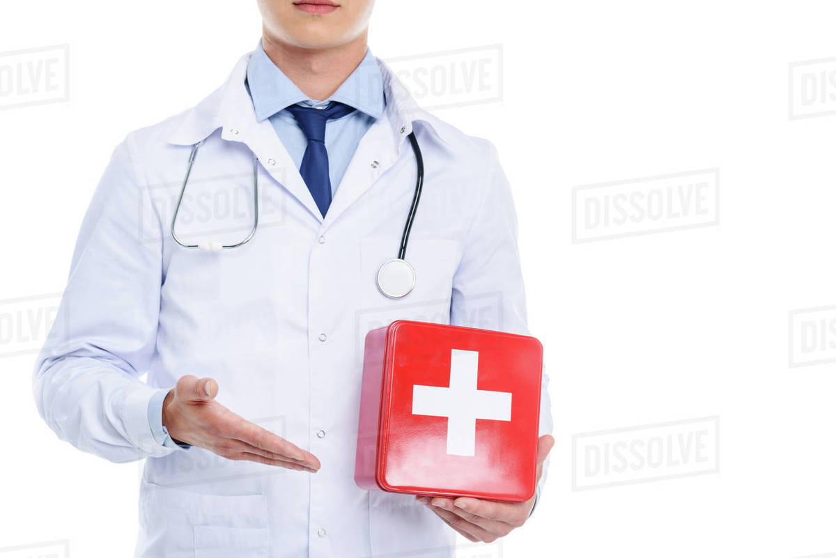Cropped view of doctor presenting red first aid kit, isolated on white ...