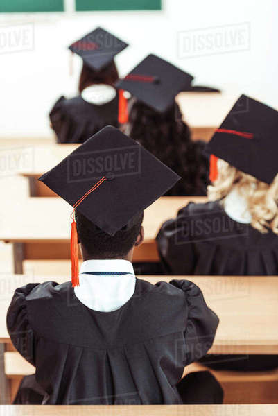 group of students in graduation hats sitting in class - Royalty-free ...