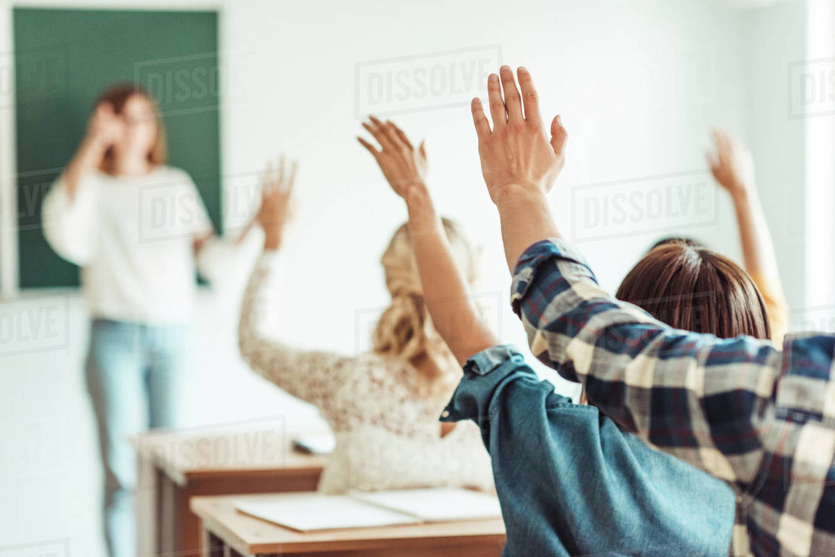 group of students raising hands in class on lecture - Royalty-free ...