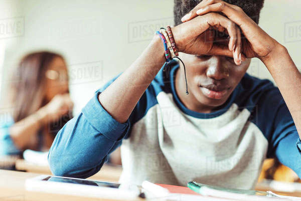 depressed young african american student sitting in class - Stock Photo ...