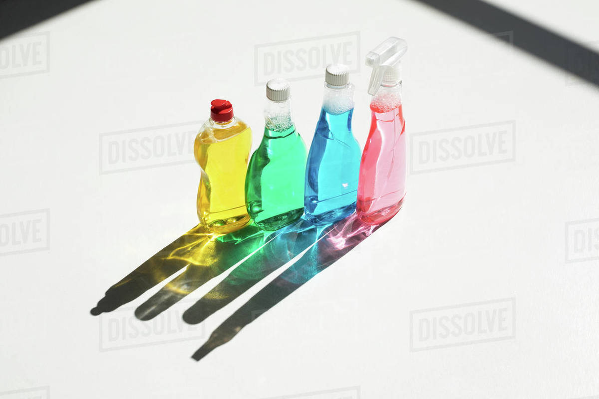 High angle view of various plastic bottles with colorful cleaning ...