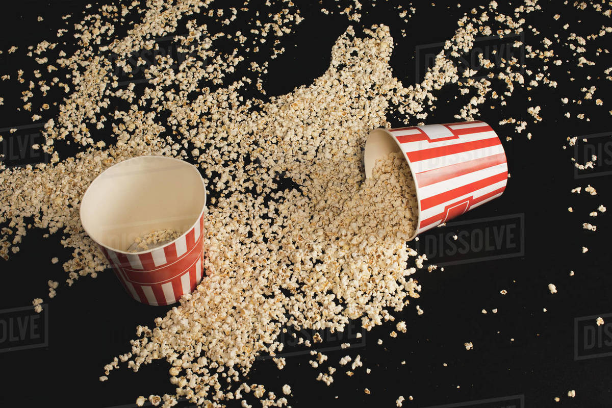 High angle view of popcorn spilled of cardboard buckets - Royalty-free ...