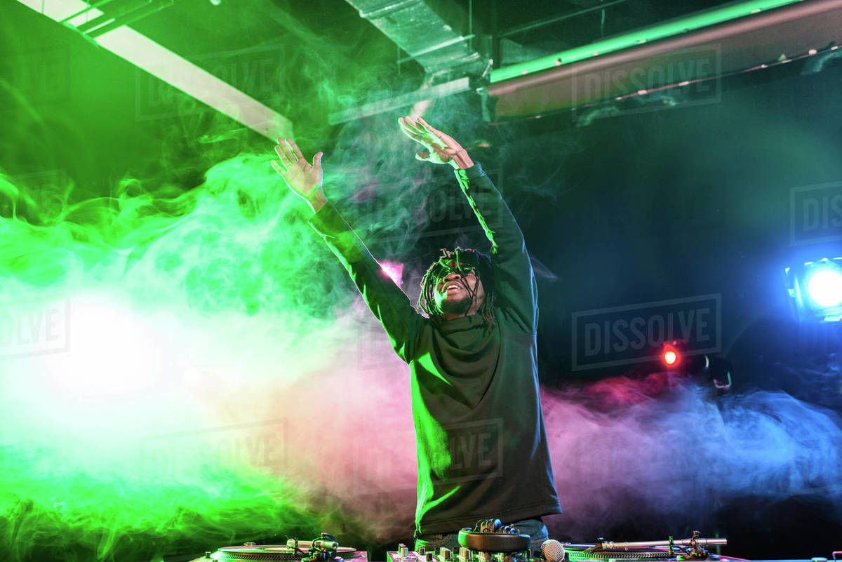 Professional African American club dj with mixer in nightclub - Royalty ...