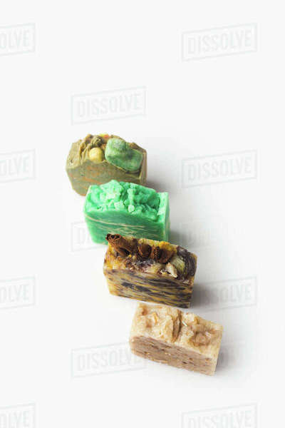 close-up shot of natural handcrafted soap bricks in row on white ...