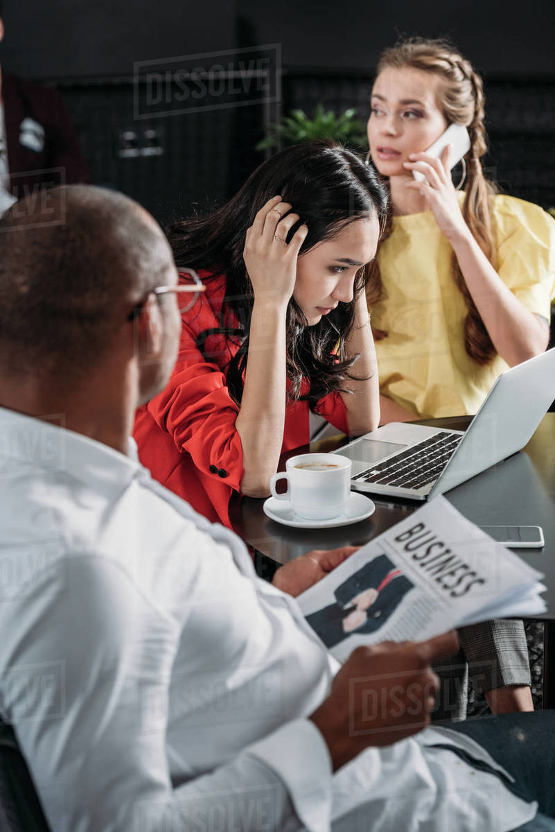 Multiethnic group of managers working together - Stock Photo - Dissolve