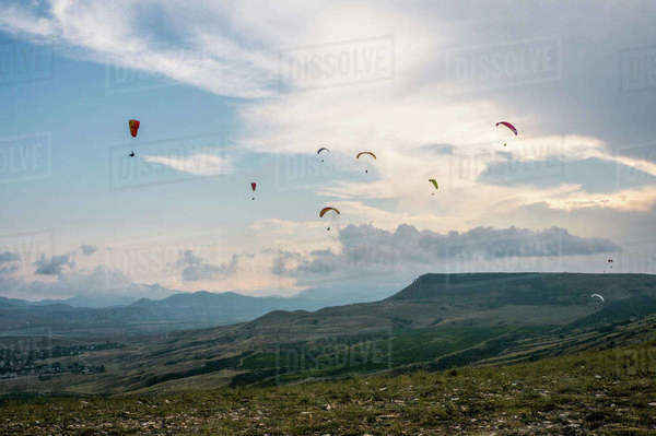 people flying on paraplanes sky with clouds on background - Royalty ...