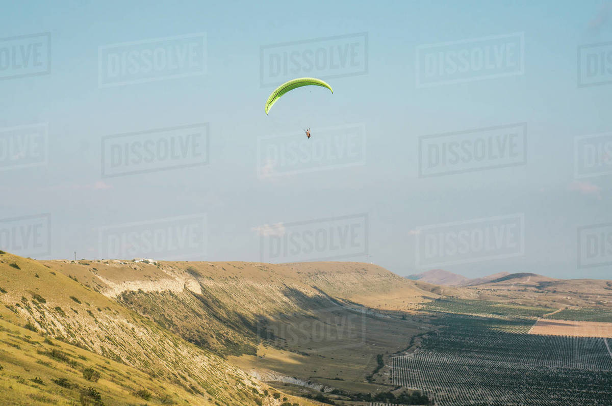 person flying on paraplane, beautiful sky on background - Stock Photo ...