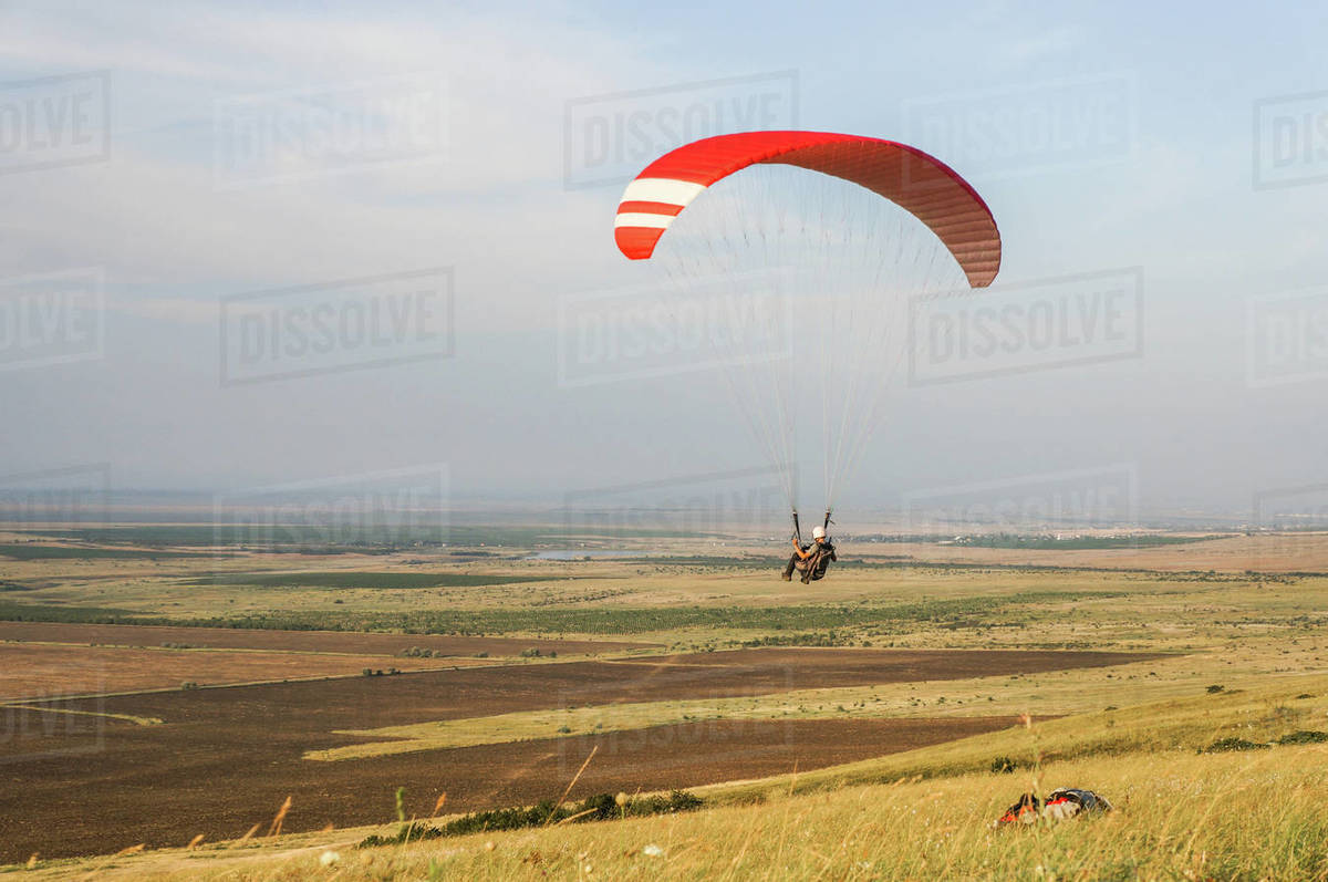 person flying on paraplane sky with clouds on background - Stock Photo ...