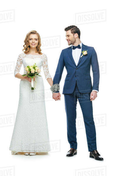 Chained wedding couple holding hands isolated on white - Royalty-free ...