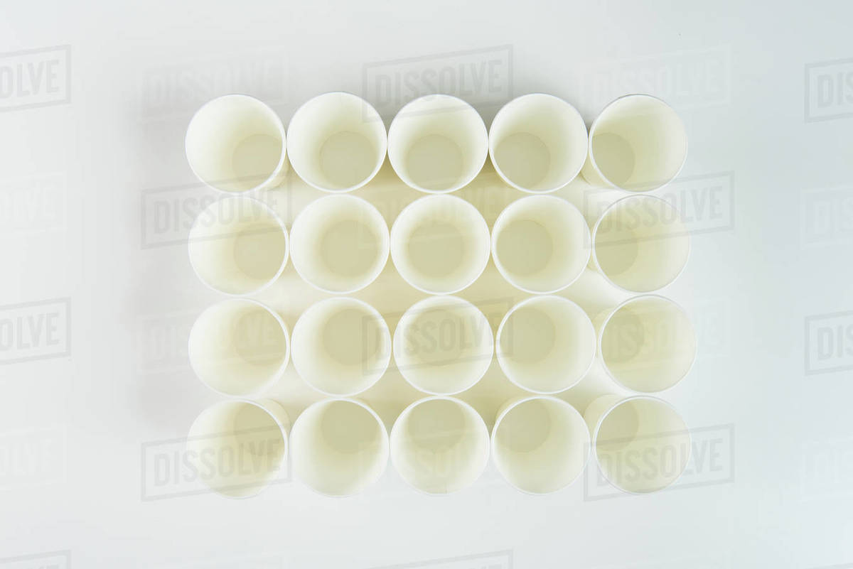 Close-up top view of empty plastic cups isolated on grey - Stock Photo ...