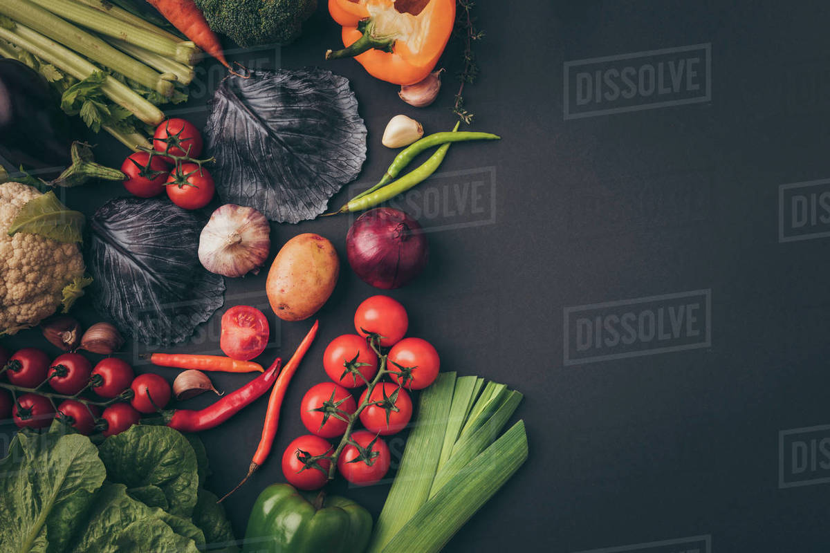 Top view of colored vegetables on gray table - Royalty-free Stock Photo ...
