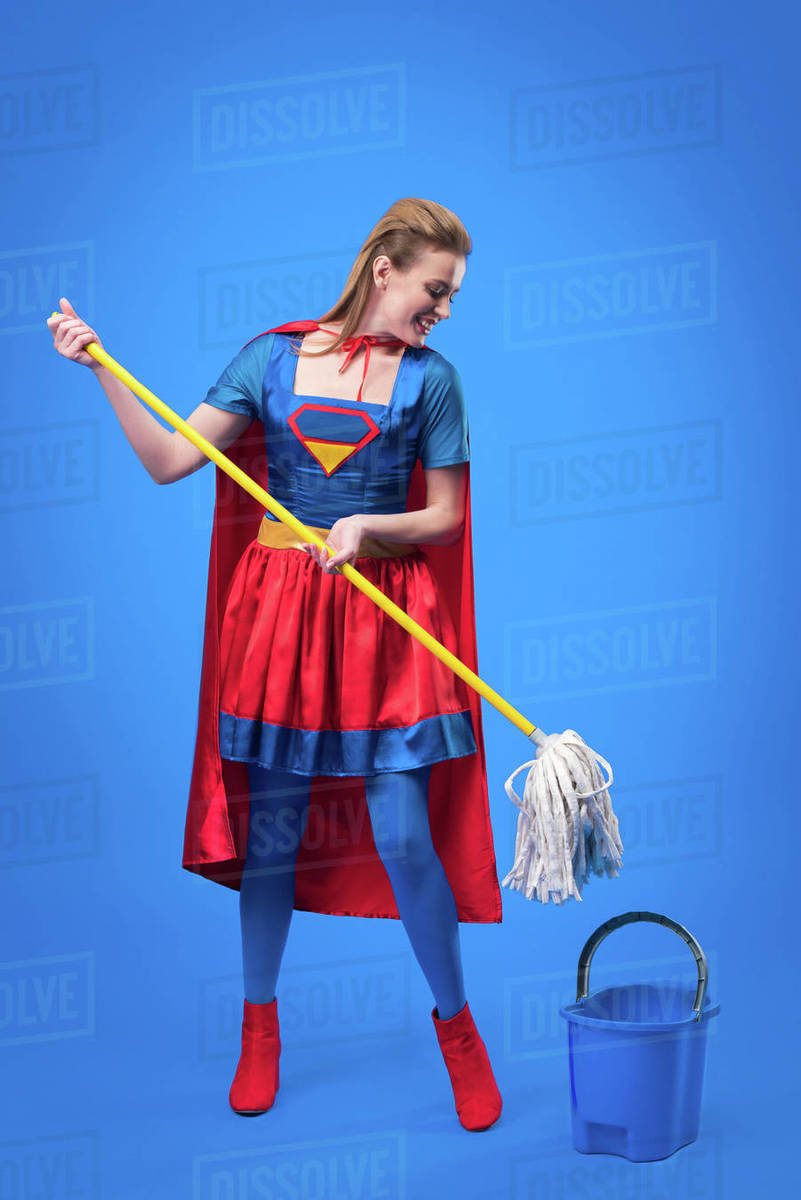 Woman in superhero costume with mop and bucket for cleaning isolated on ...