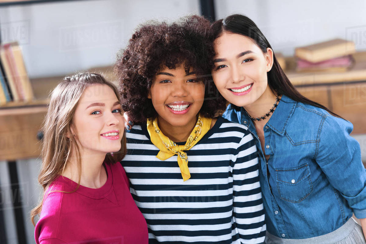 Portrait of cheerful multiracial students looking at camera - Stock ...