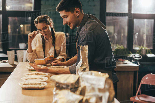 Coffee shop workers checking coffee quality during coffee food function ...