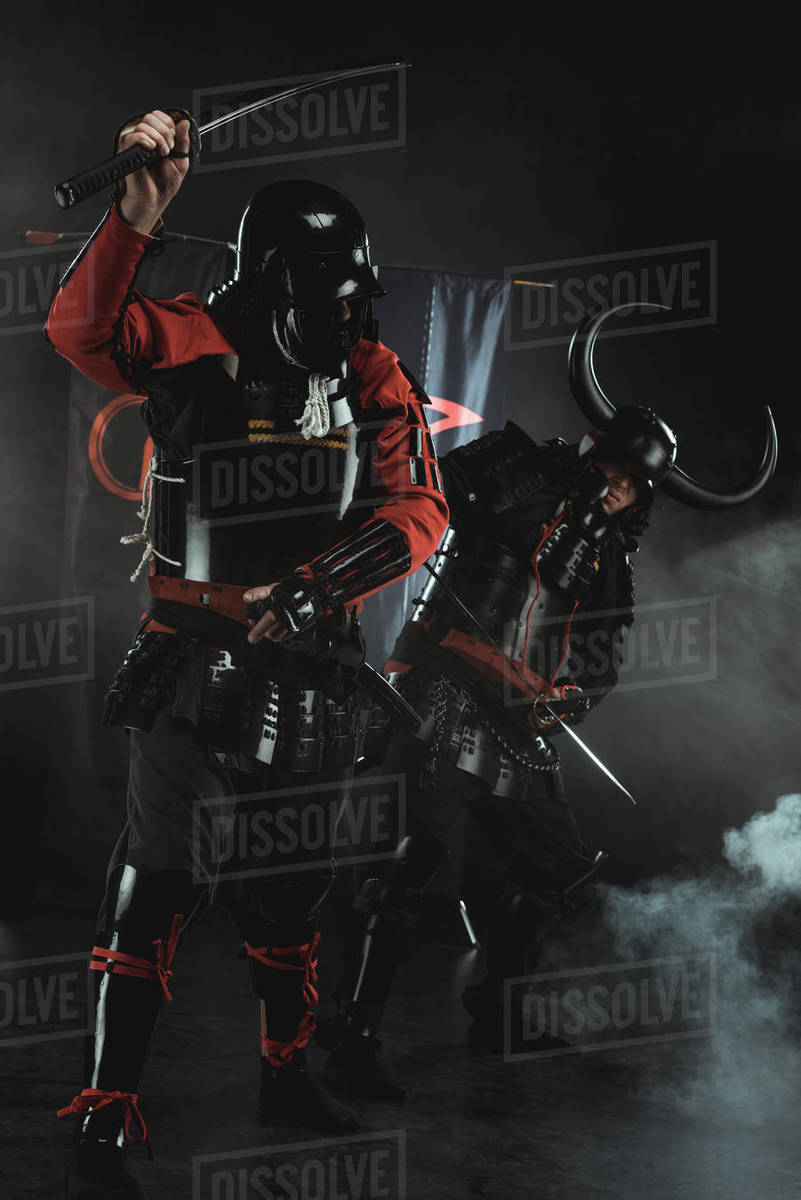 Armored samurai fighting with swords in front of clan symbols on flags ...