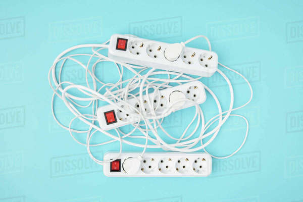 top view of arrangement of extension cords isolated on blue - Stock ...