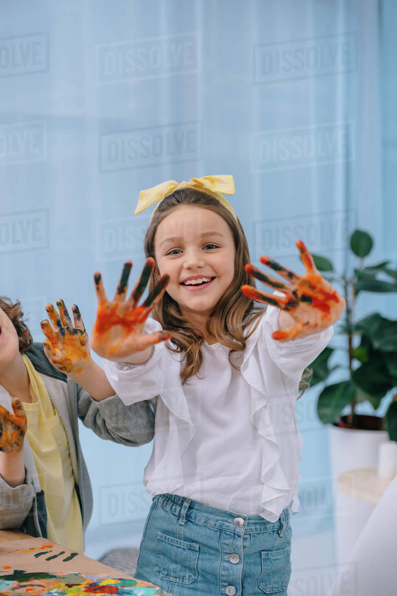 Adorable happy kids showing their colored hands in paint - Royalty-free ...