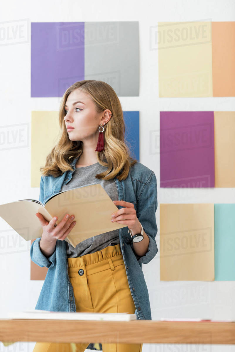 Young magazine editor with color palette behind - Royalty-free Stock ...