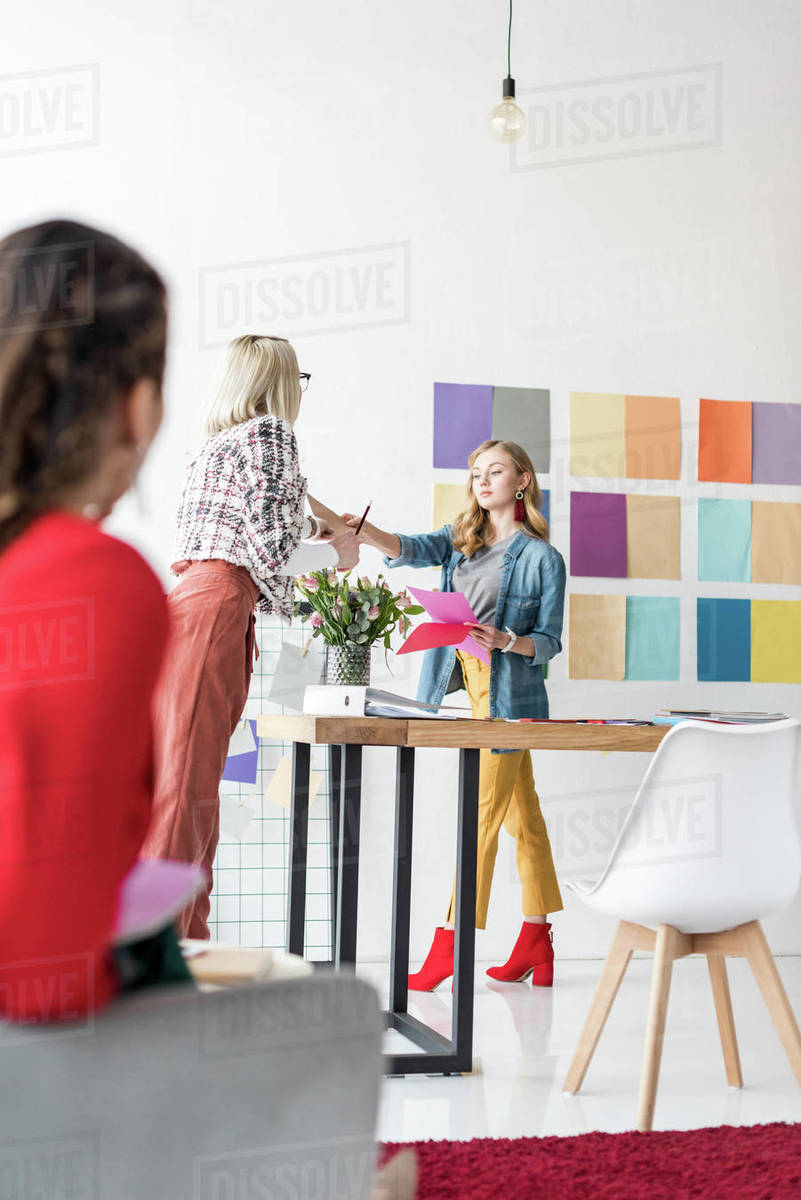 Fashionable magazine editors working in modern office - Stock Photo ...