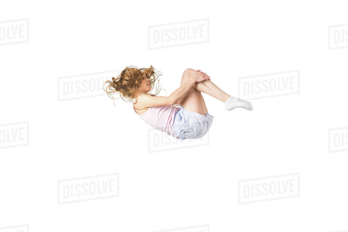 Side view of young woman falling isolated on white - Royalty-free Stock ...