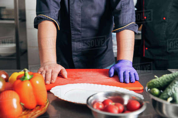 Cropped shot of chef standing at workplace in restaurant - Stock Photo ...