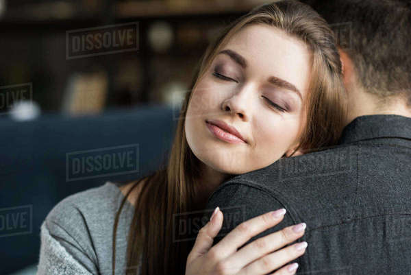 cheerful girlfriend hugging boyfriend with closed eyes - Royalty-free ...