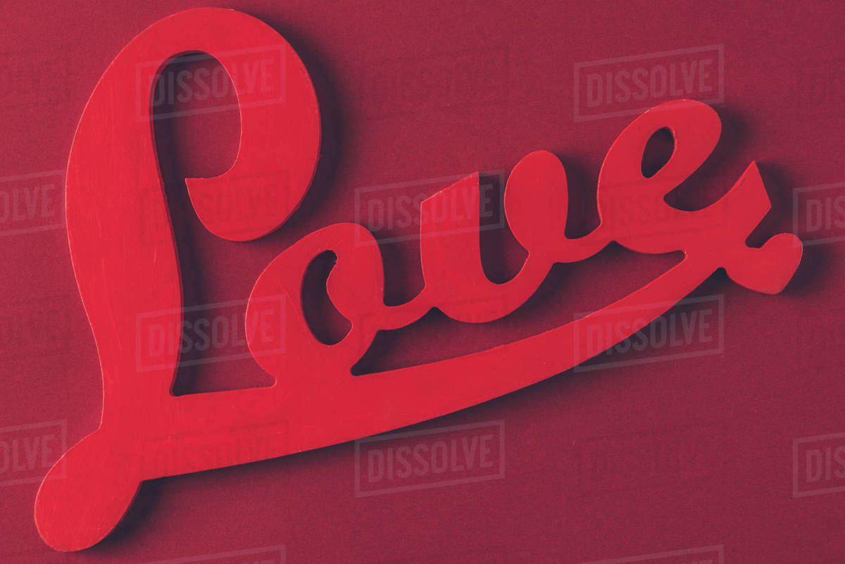 Top view of red sign with word love isolated on burgundy - Royalty-free ...