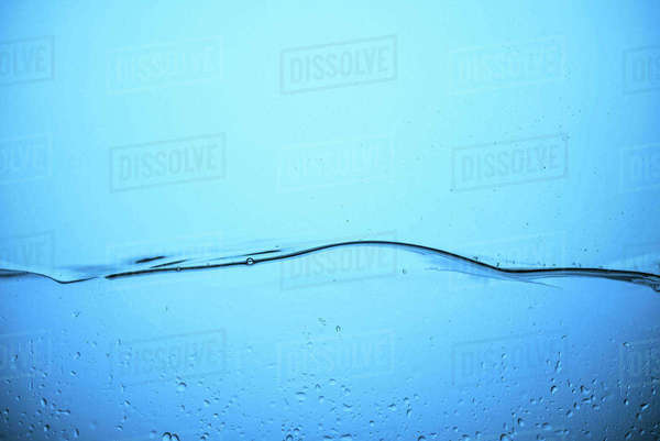 Pure water texture with drops, isolated on blue - Royalty-free Stock ...