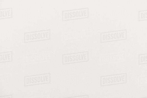 Texture of beige color paper as background - Stock Photo - Dissolve
