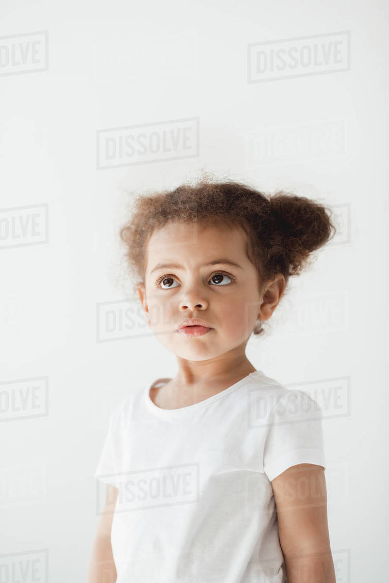 Adorable little kid girl looking aside isolated on white - Royalty-free ...