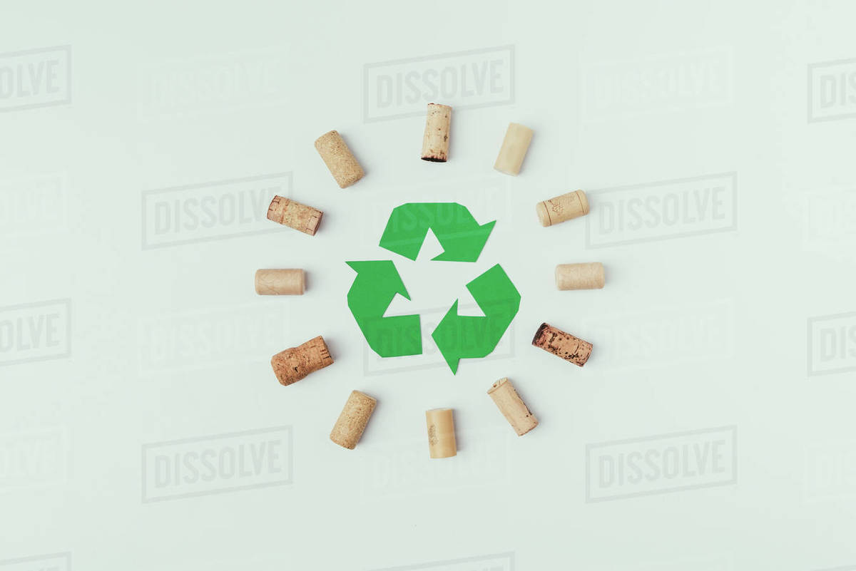 Top view of recycle sign and bottle corks around isolated o grey ...