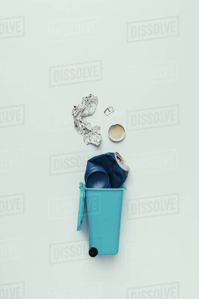 Top view of trash bin with assorted garbage isolated on grey, recycling ...